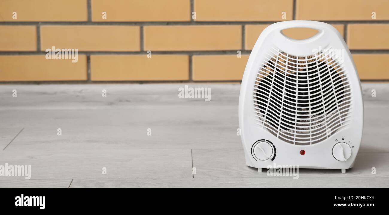 Electric fan near brick wall. Banner for design Stock Photo - Alamy