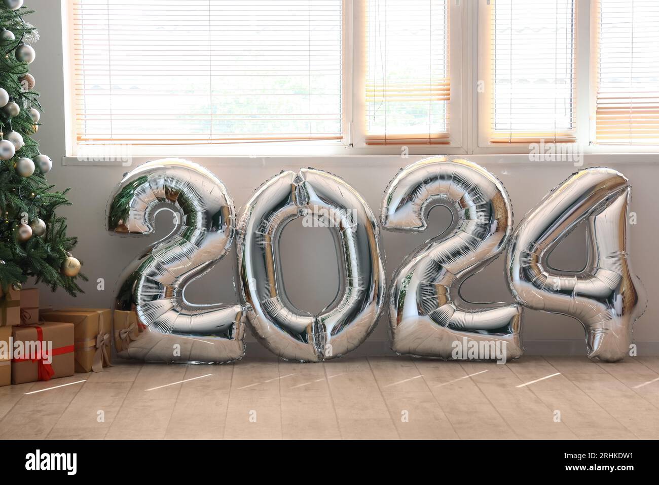 Balloons in shape of figure 2024 in light room near window Stock Photo ...