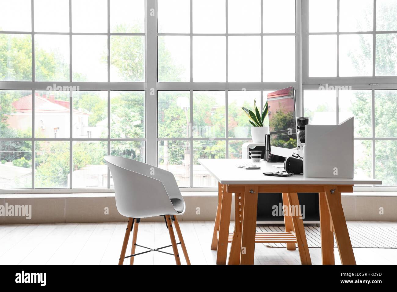 Programmer's workplace in interior of light office Stock Photo - Alamy