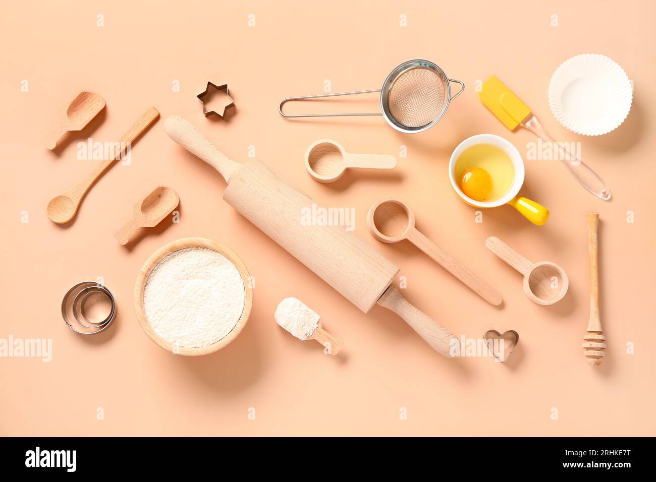 Baking utensils on beige background Stock Photo - Alamy