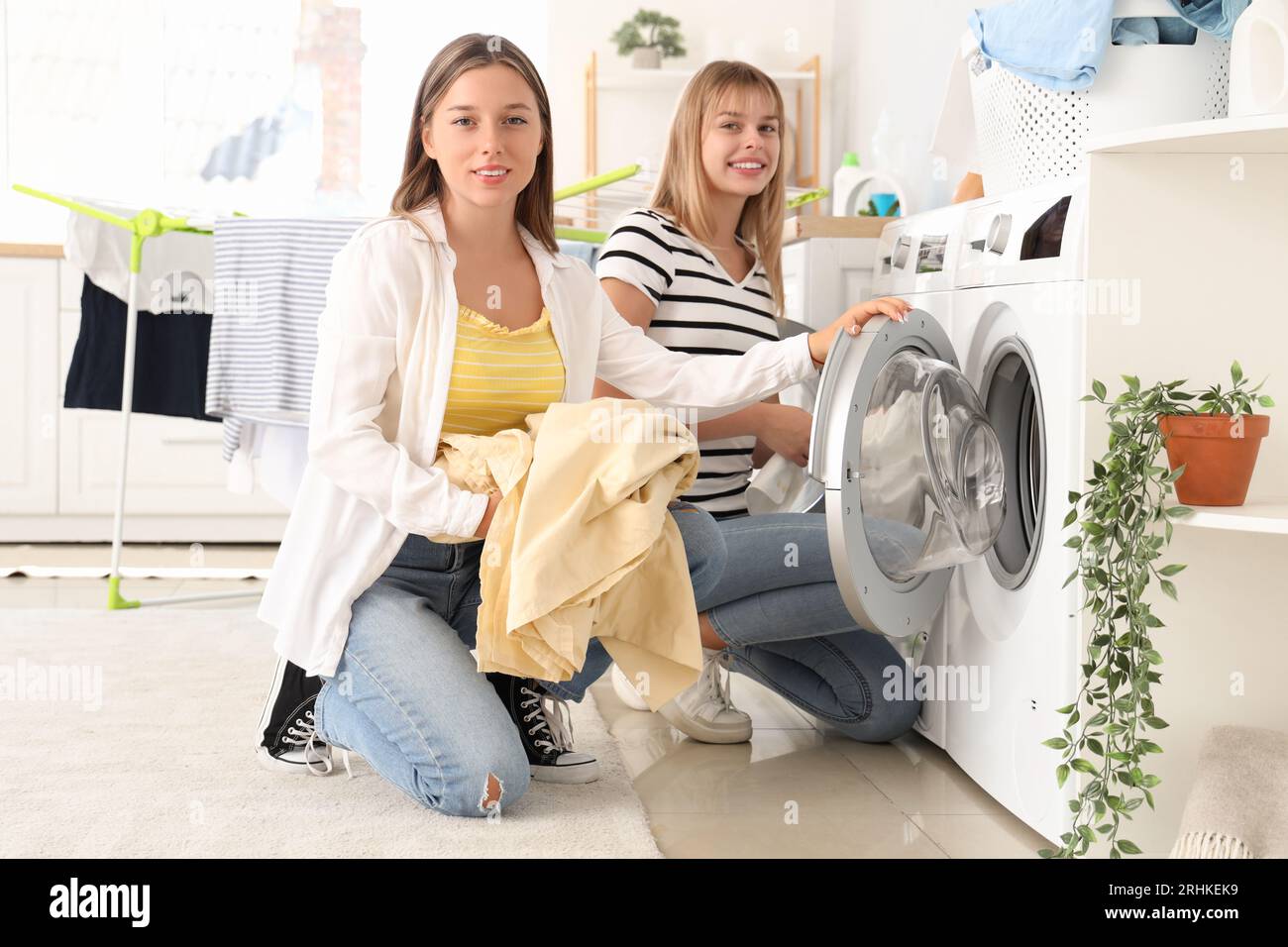 Female students doing laundry in dormitory Stock Photo - Alamy