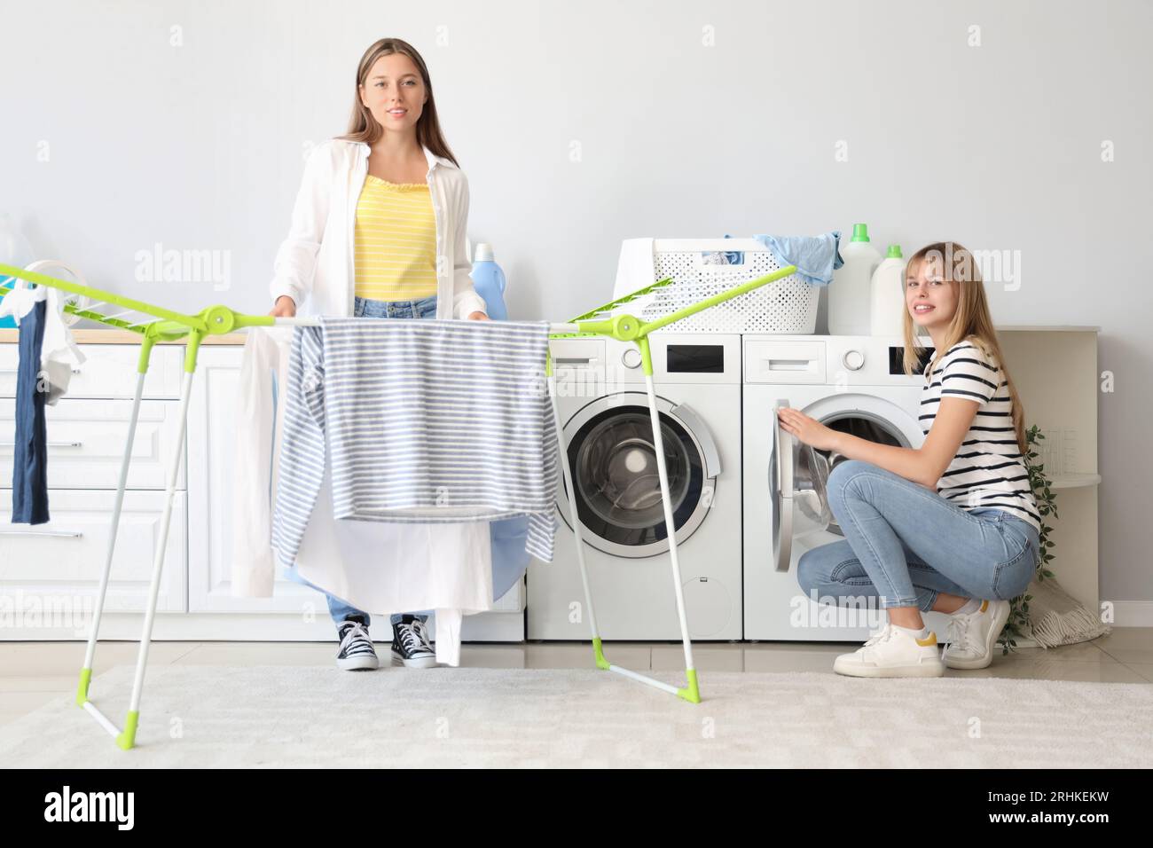 Female students doing laundry in dormitory Stock Photo - Alamy