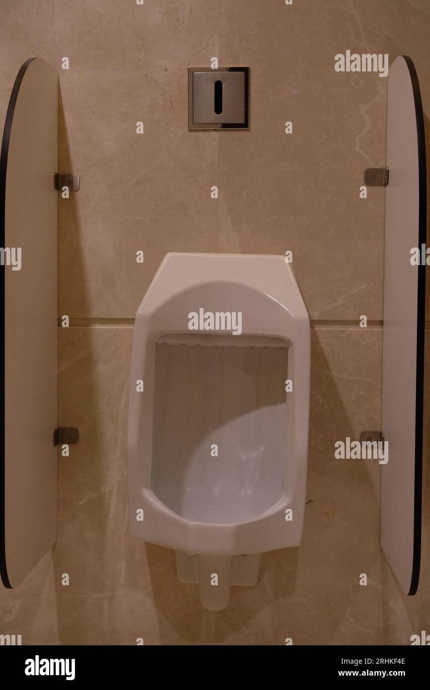 Ceramic Urinal with Sensor for Automatic Flushing Stock Photo - Alamy