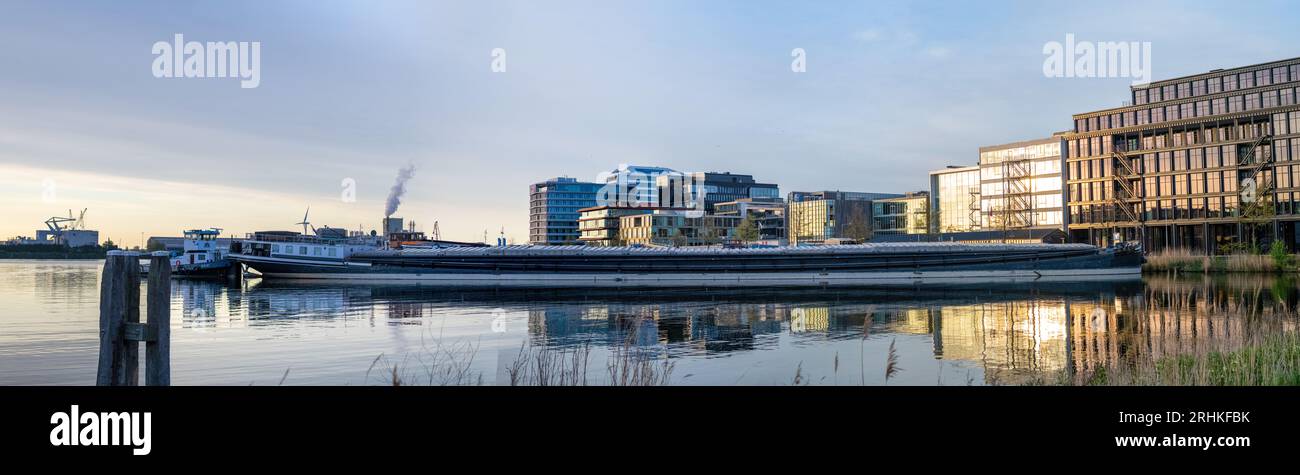 River cargo vessel in Amsterdam Stock Photo - Alamy