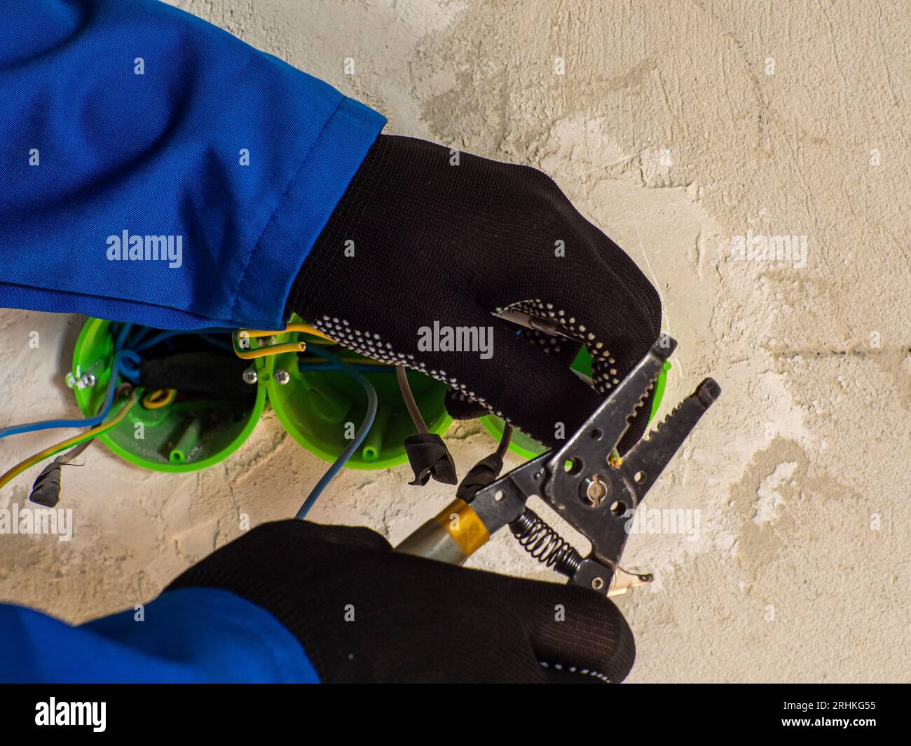 Professional electrician working on home electrical system Stock Photo ...