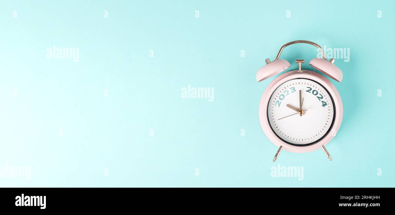 New year 2024 is loading, calendar date on an alarm clock, end of the ...