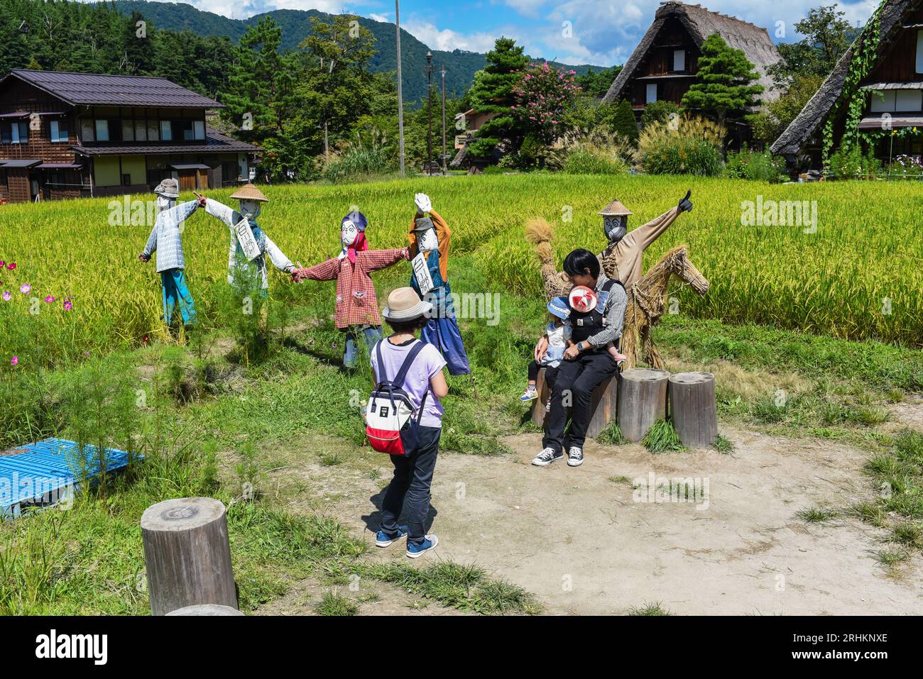 Scarecrows in front of traditional Gassho-Zukuri thatched wooden ...