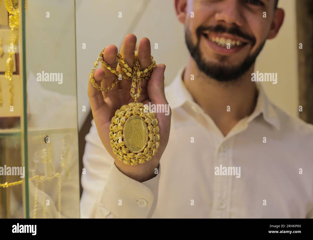 Gaza, Palestine. 17th Aug, 2023. A Palestinian man displays gold ...
