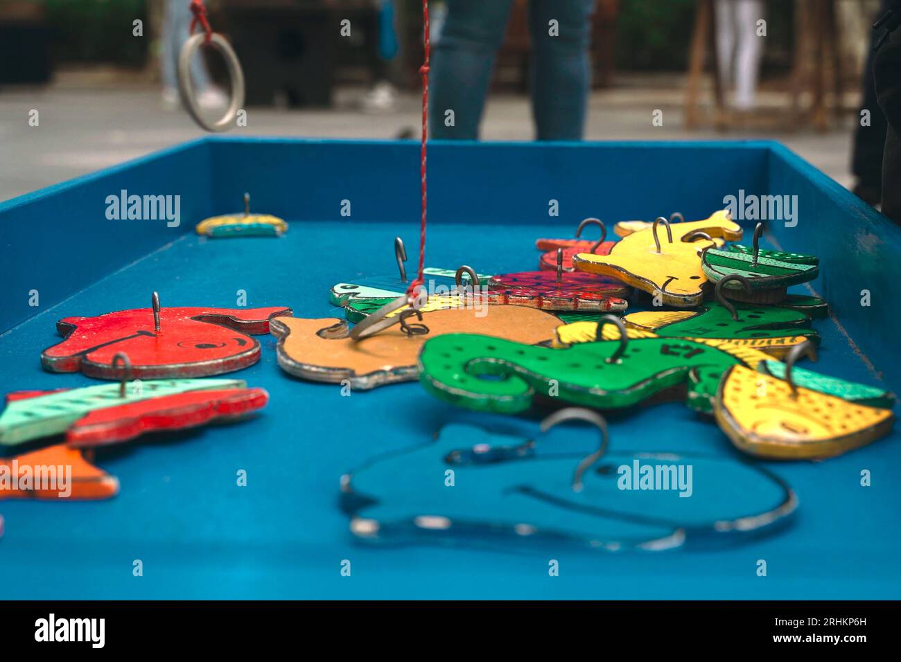 Children play a board wooden educational game - fishing. They catch ...