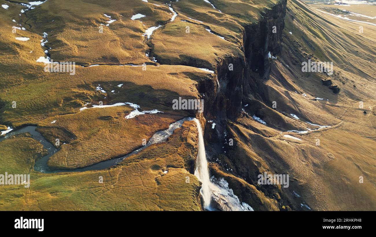 Water stream flowing among nordic fields in iceland, majestic foss a ...
