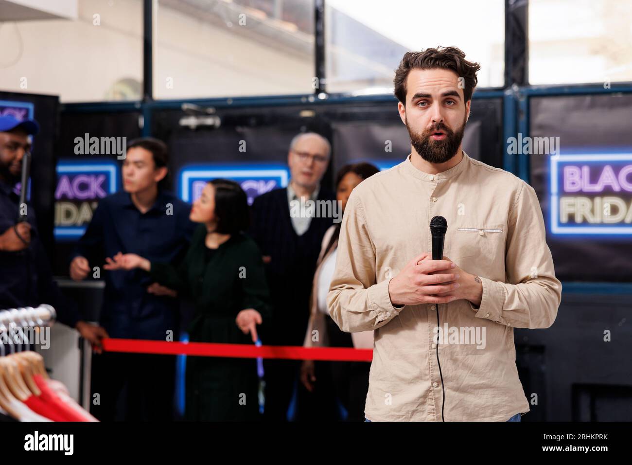 Young man journalist making news about Black Friday biggest shopping ...