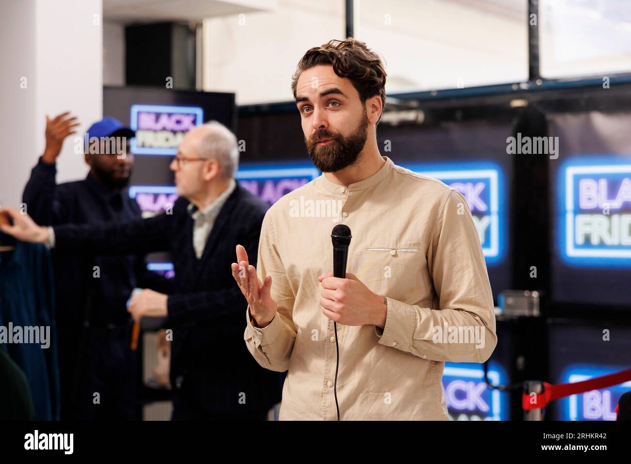 Television journalist holding microphone broadcasting news about Black ...