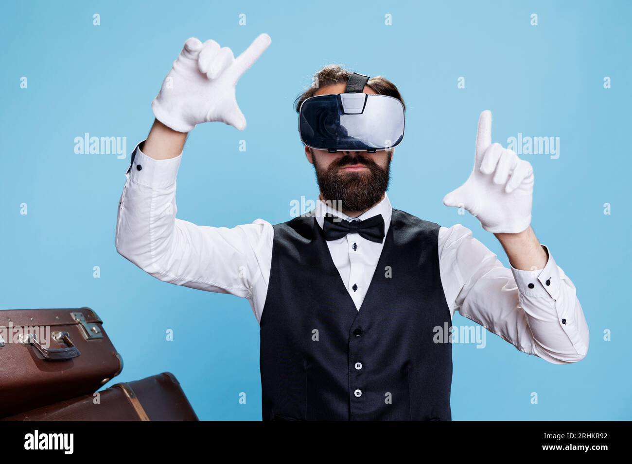 Modern doorkeeper using vr headset against blue background, enjoying 3d ...