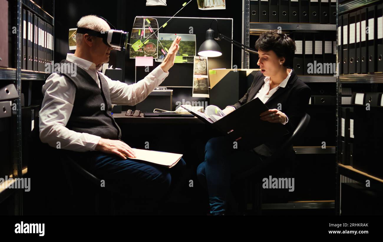 Senior inspector using vr glasses to reenact crime scene in police ...