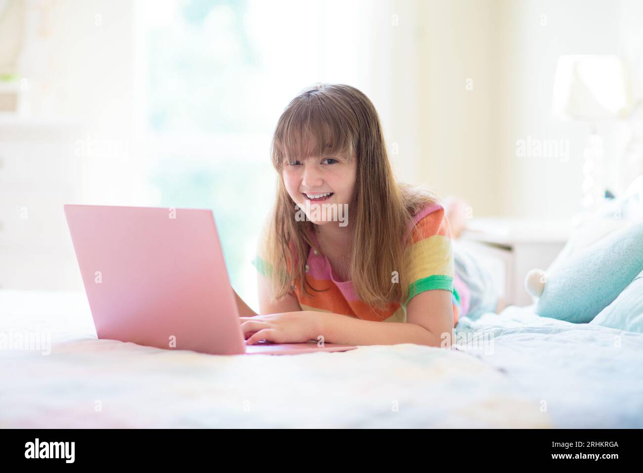 Teenager with computer. Girl chatting with friends on website. Student ...