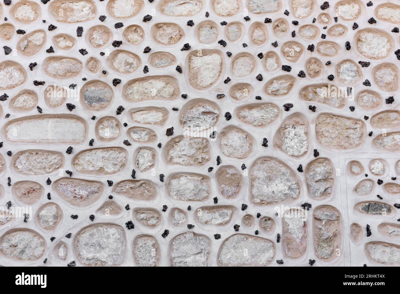 Stone facade of the Alcazar of Segovia, Spain, round stones built in ...