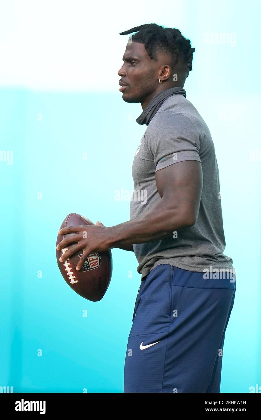 Miami Dolphins wide receiver Tyreek Hill prepares to throw the ball ...