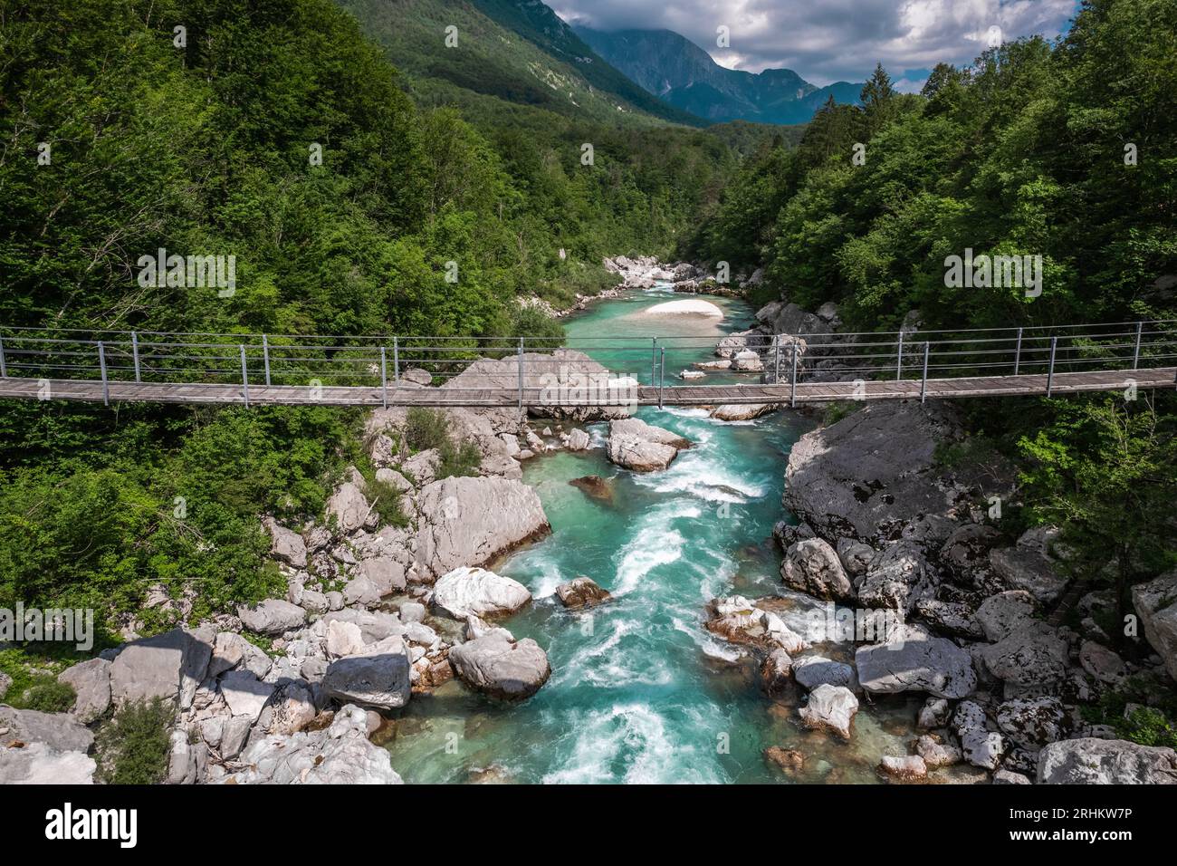 Suspension bridge over alpine Soca river in Slovenia Stock Photo - Alamy