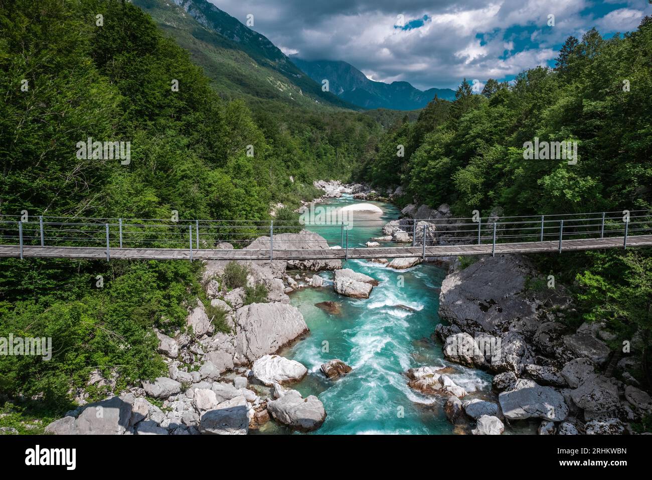 Suspension bridge over alpine Soca river in Slovenia Stock Photo - Alamy