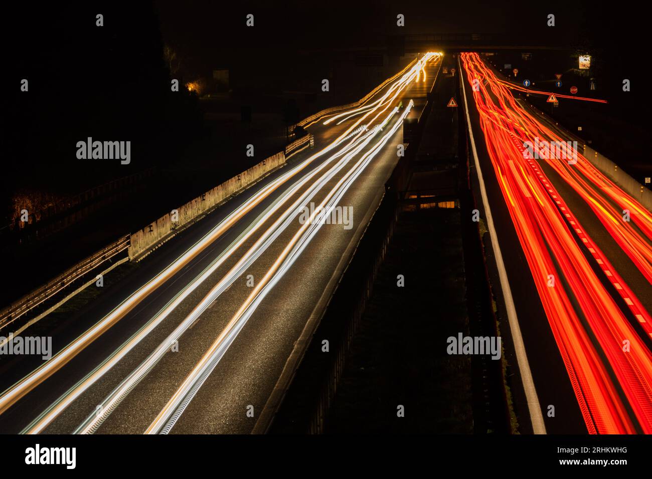 Abstract image of night traffic lights on the road. Car light trails at ...