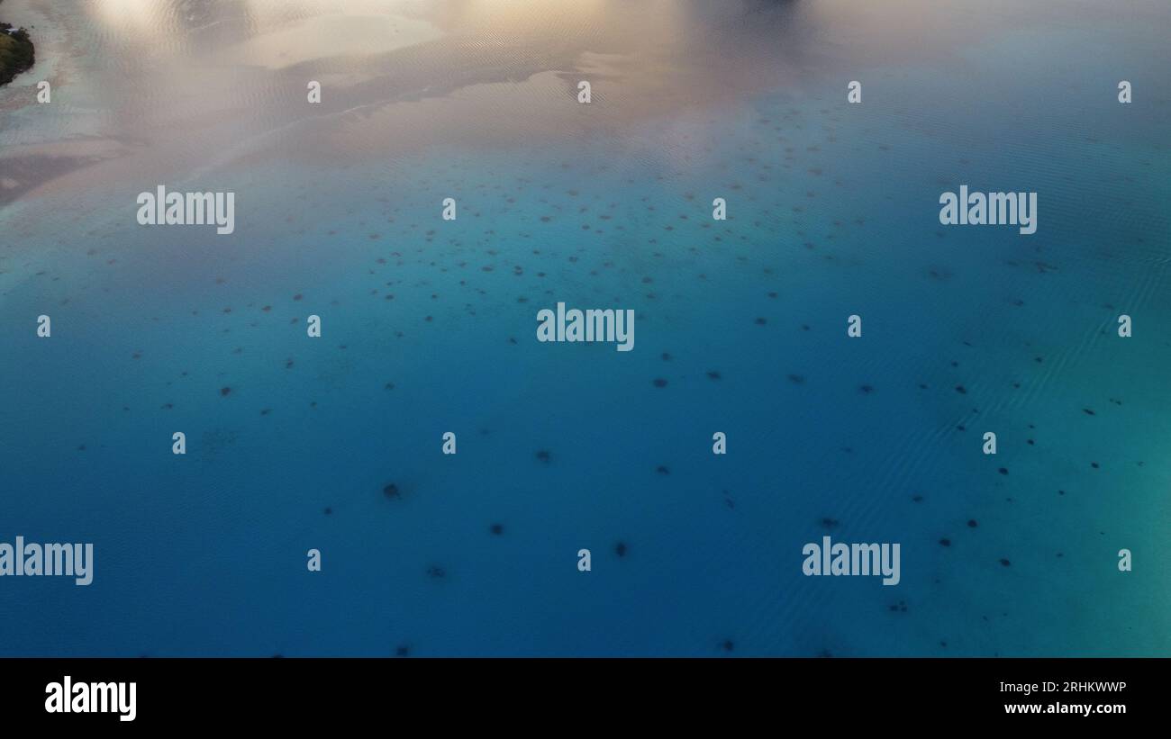 Aerial sunset views of the stunning Bora Bora Atoll; French Polynesia ...