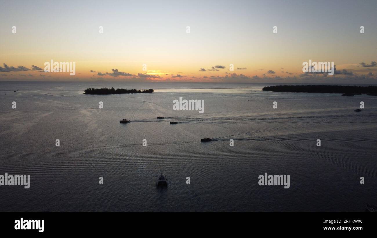 Aerial sunset views of the stunning Bora Bora Atoll; French Polynesia ...