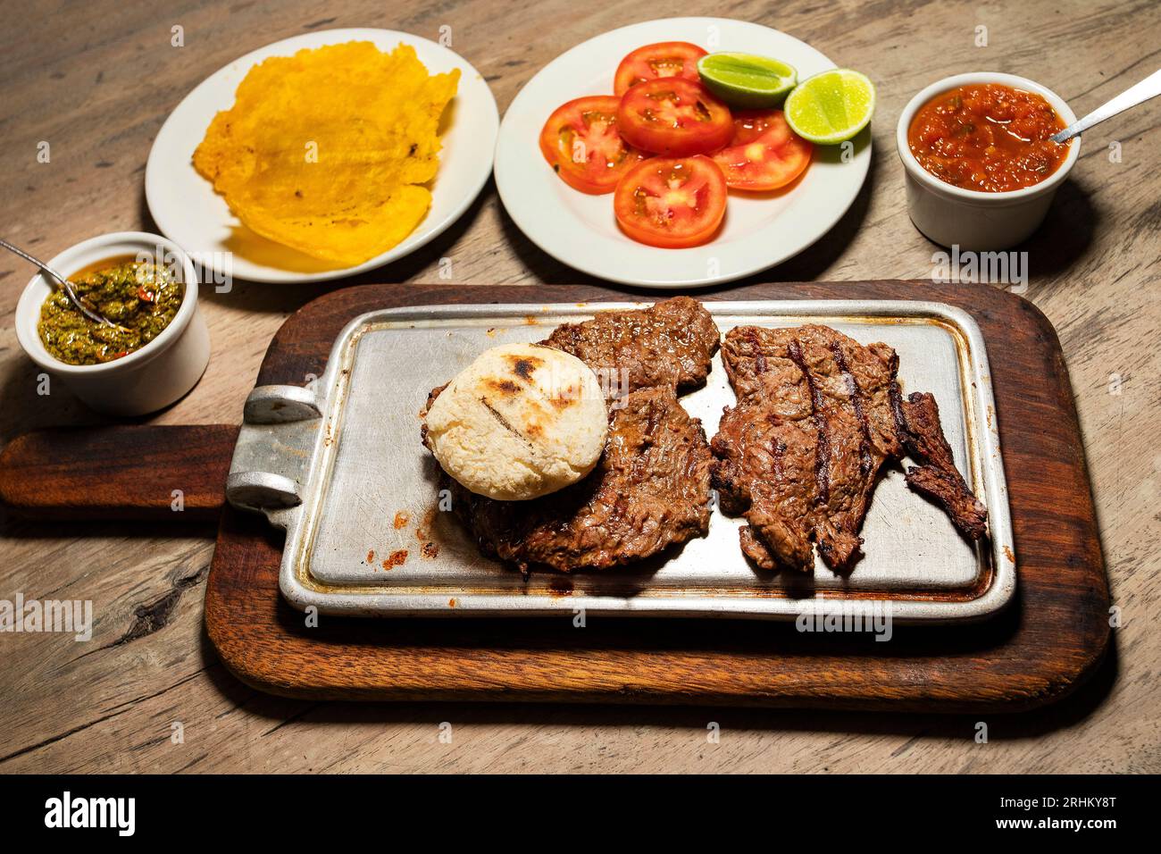 Roasted sirloin steak with plantain patacon - Colombian traditional ...
