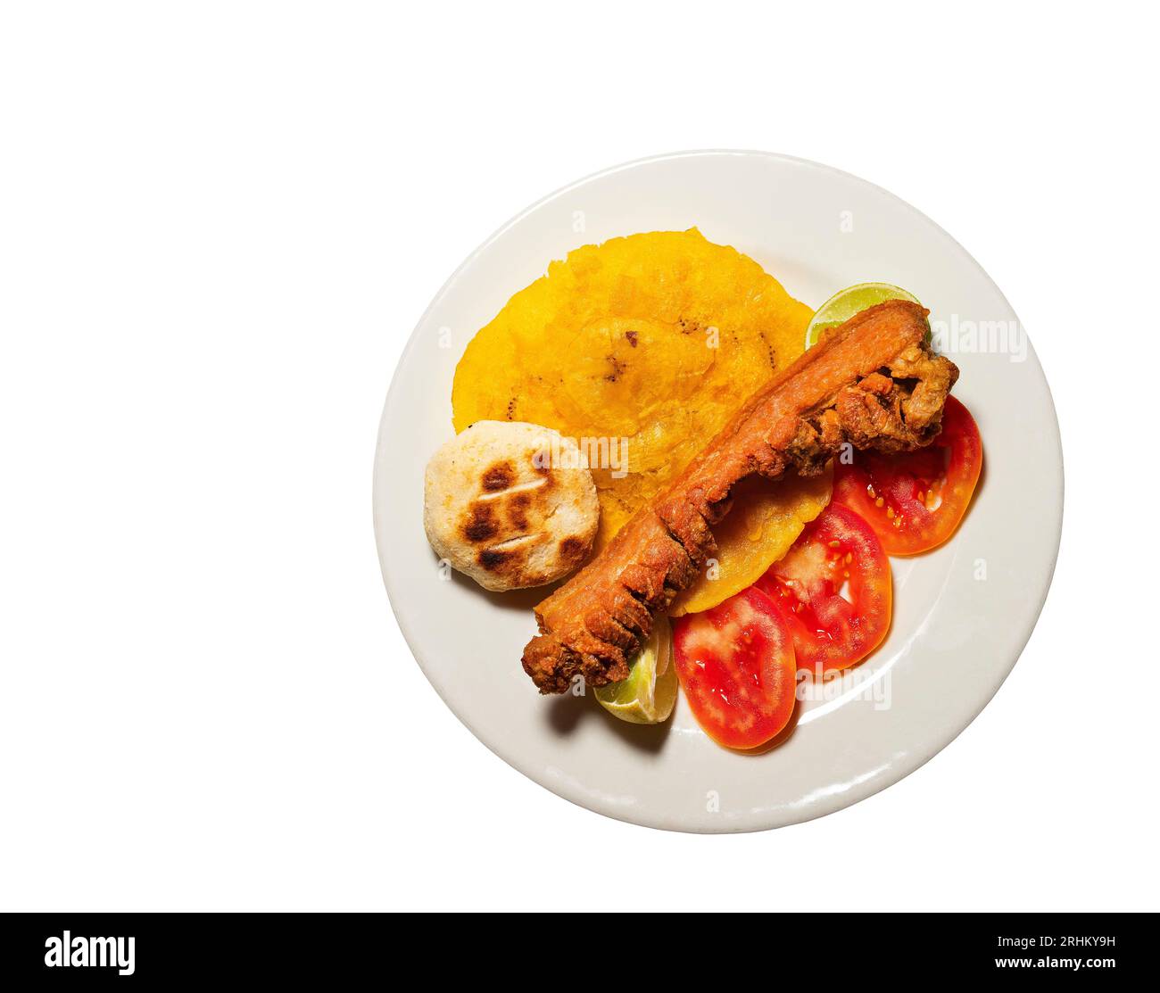 Pork chicharron with patacones and sliced tomatoes - Colombian ...