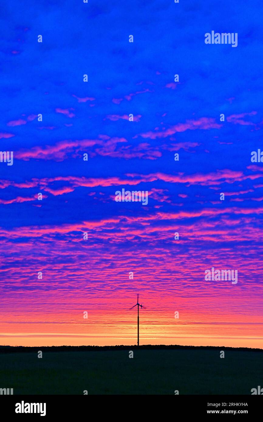 Early morning dense colourful blue red sky and dense cloud with ground ...