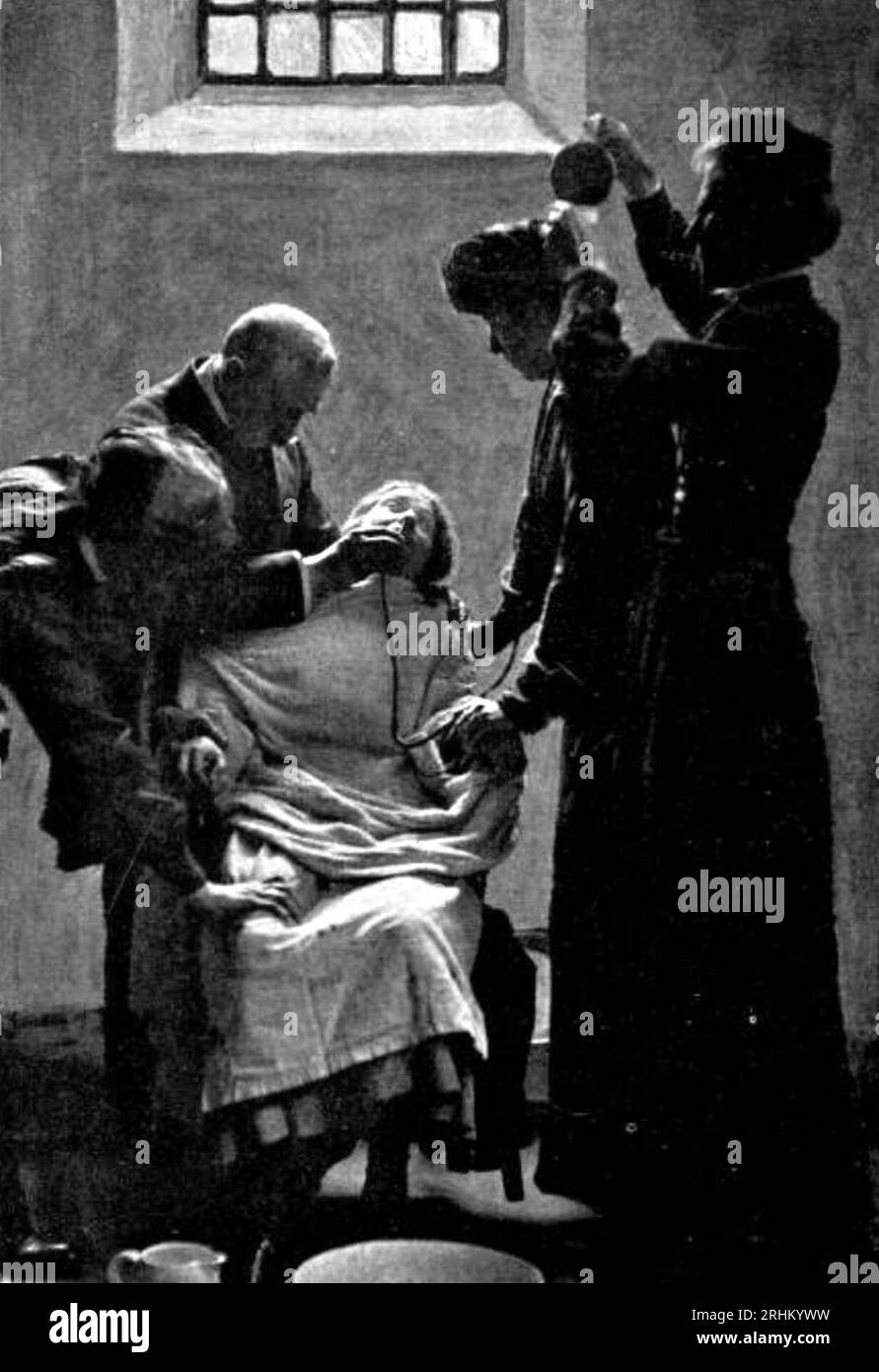 A Suffragette being force-fed in prison Stock Photo - Alamy