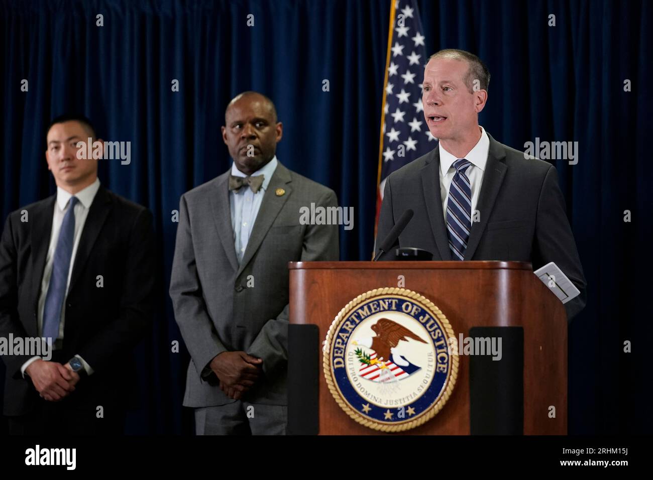 Robert Tripp, special agent in charge of the FBI's San Francisco Field Office, right, speaks to ...