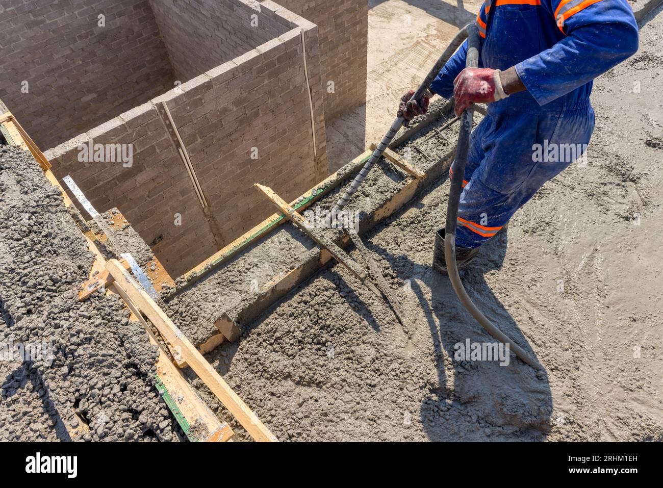 boom concrete pump, pouring concrete on the top floor african worker ...