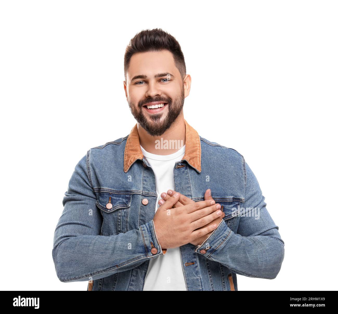 Thank you gesture. Happy grateful man holding hands near heart on white ...