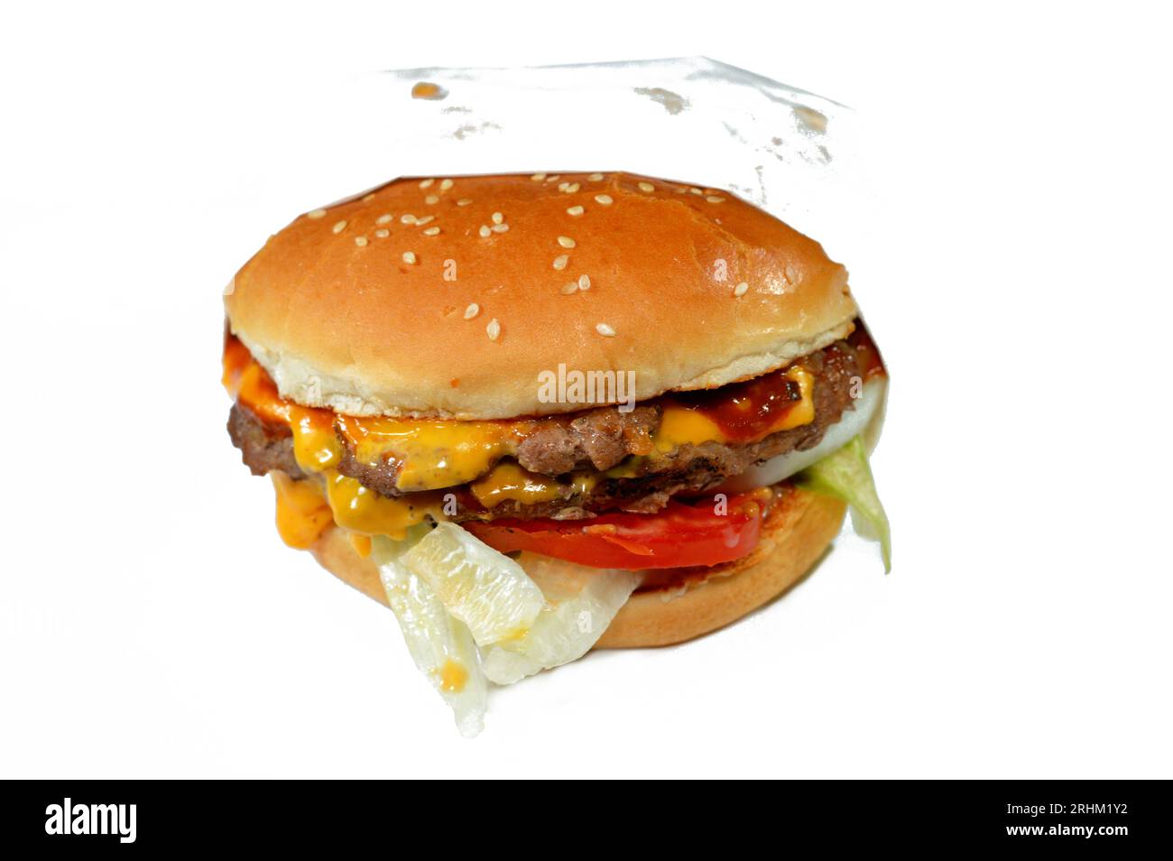 A juicy thick double beef patty with cheese covered with sauce, crispy ...