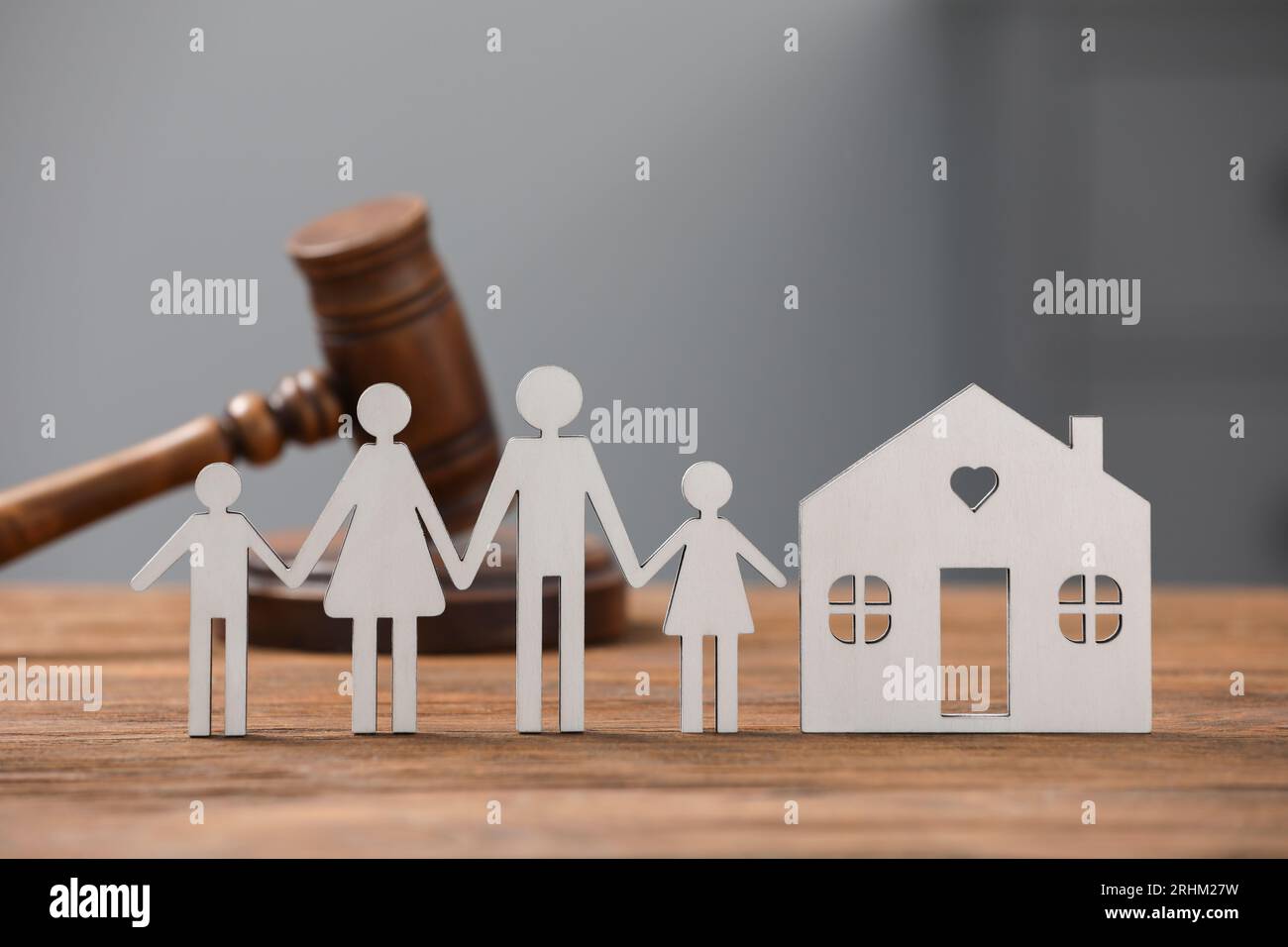 Family law. Figure of parents with children, house model and gavel on ...