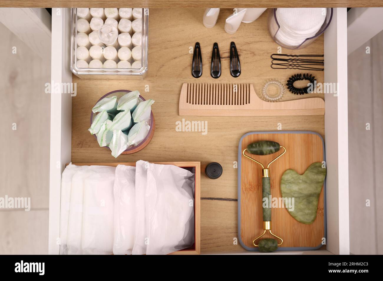 Open cabinet drawer with tampons and feminine hygiene products, top ...