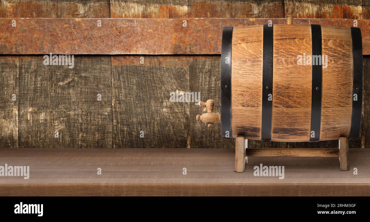 Wooden barrel on shelf, space for text. Banner design Stock Photo - Alamy