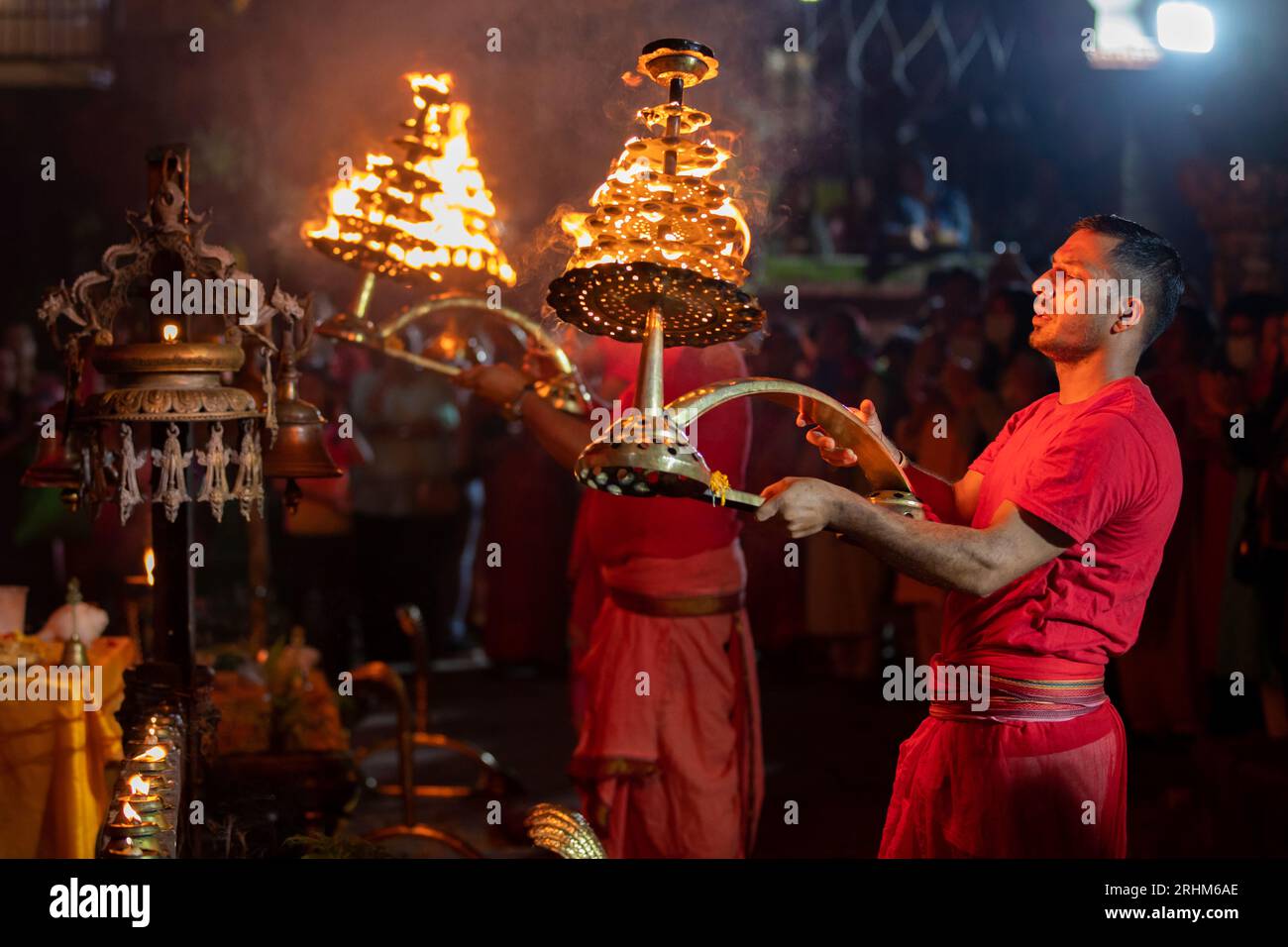 Nepalese priest performing evening arati Stock Photo - Alamy