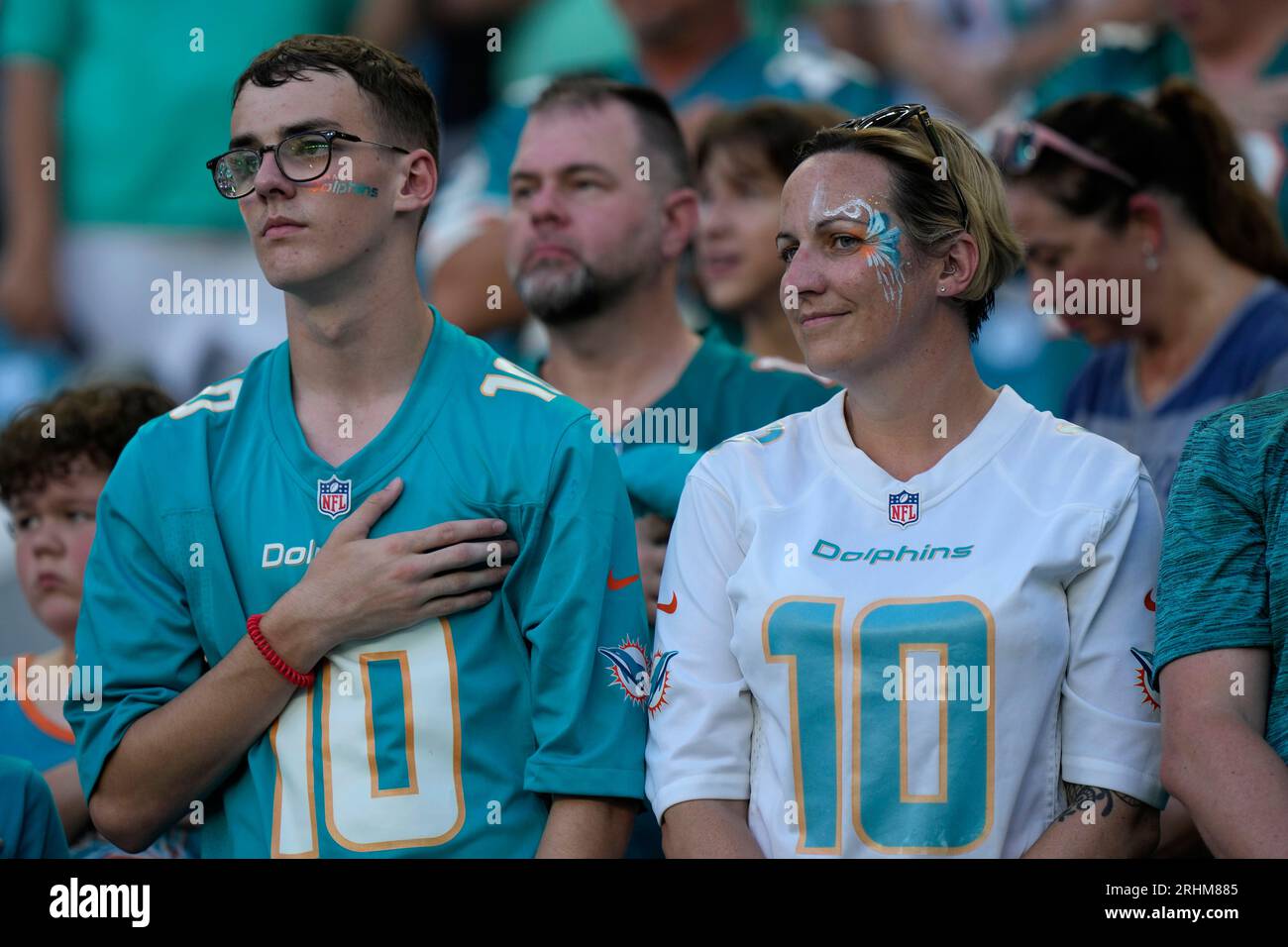 Football fans stand during the singing of the National Anthem before ...