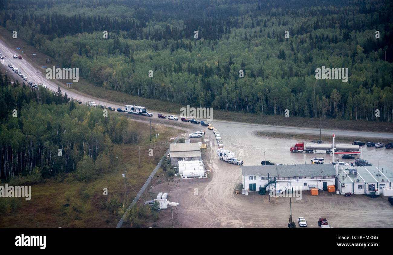 Vehicles line-up for fuel at Fort Providence, Northwest Territories, on ...