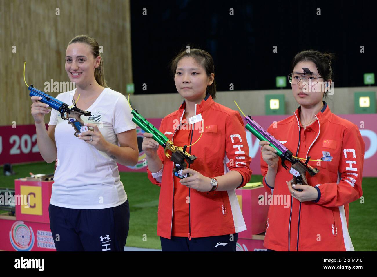 Baku, Jiang Ranxin and Li Xue of China (L to R) react after the women's ...
