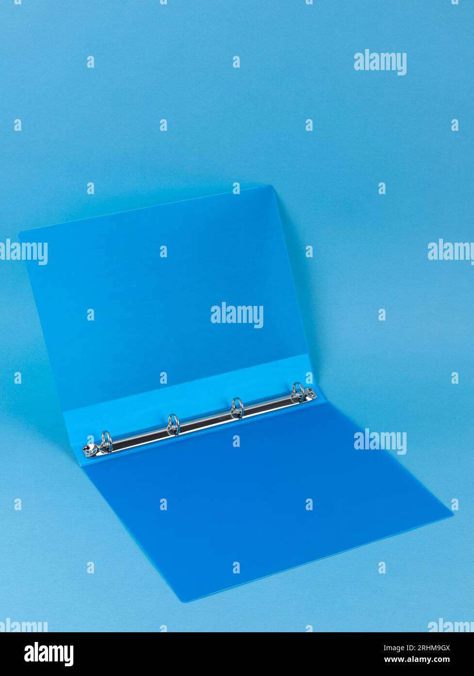 Blue plastic folder for documents isolated on blue background Stock ...