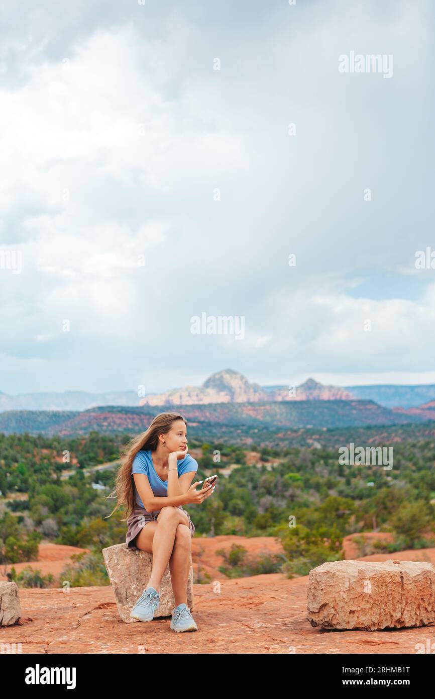 Girl on the edge of a cliff at Cathedral Rock in Sedona, Arizona Stock ...