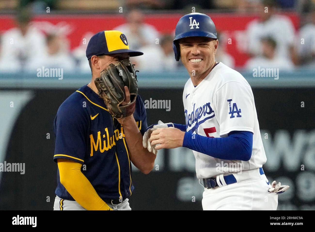Milwaukee Brewers shortstop Willy Adames, left, chats with Los Angeles ...