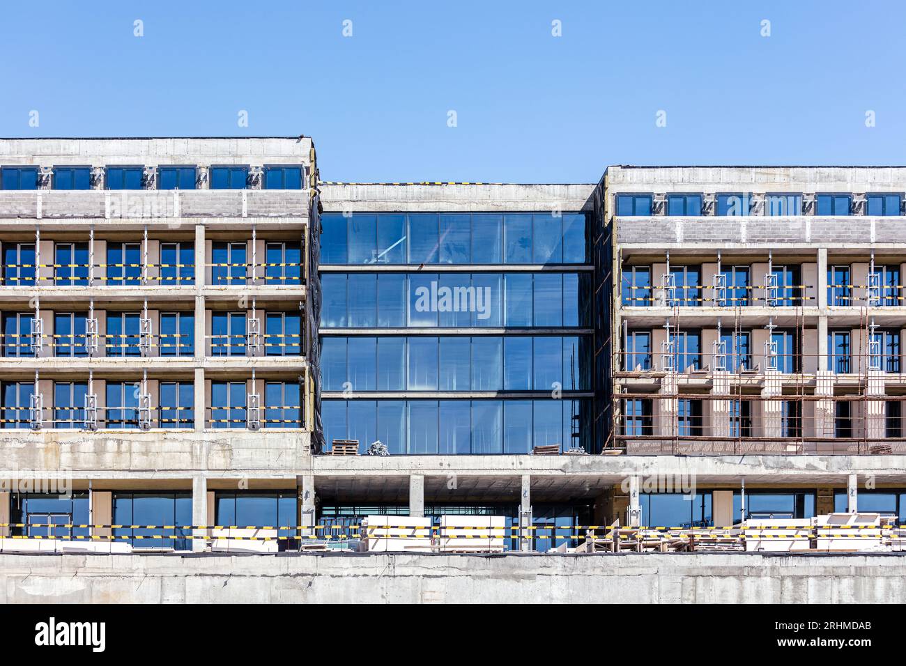 new office building under construction on blue sky background. steel ...