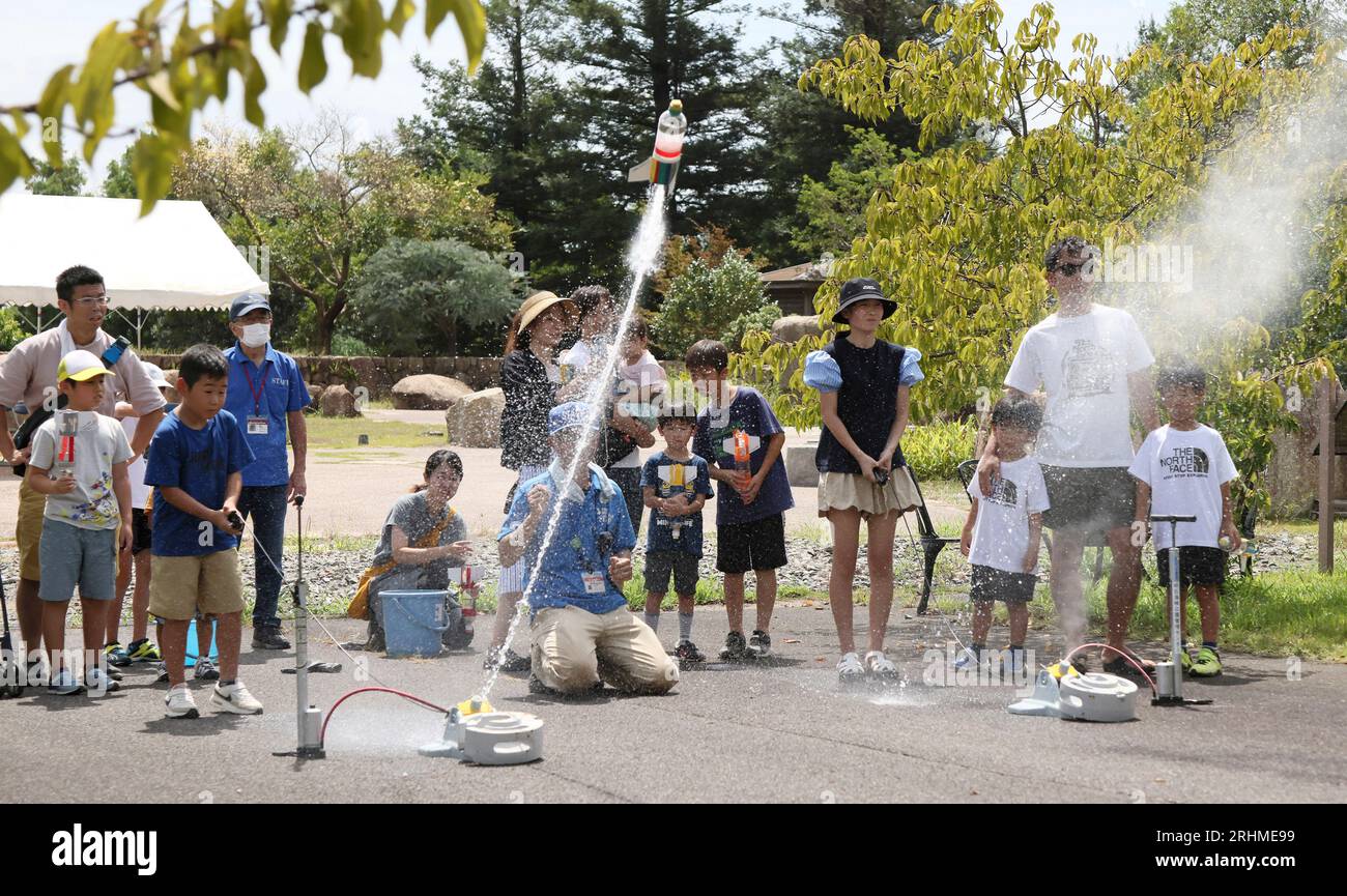 Children vigorously launch water rockets made from plastic bottle at ...