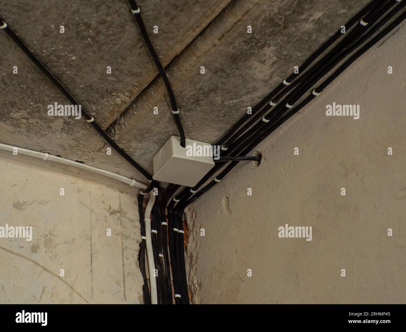 White plastic electric junction box with conduits install in house ...