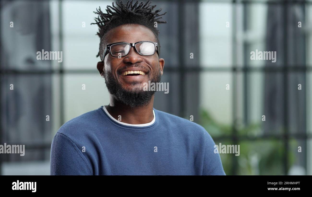 Portrait of a smiling CEO at workplace in a modern office in casual ...