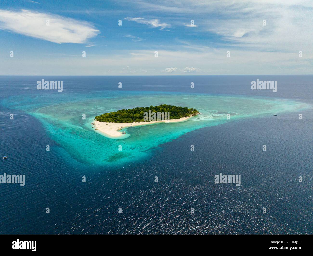 Tropical island surrounded on Mantigue Island. Turquoise water and ...