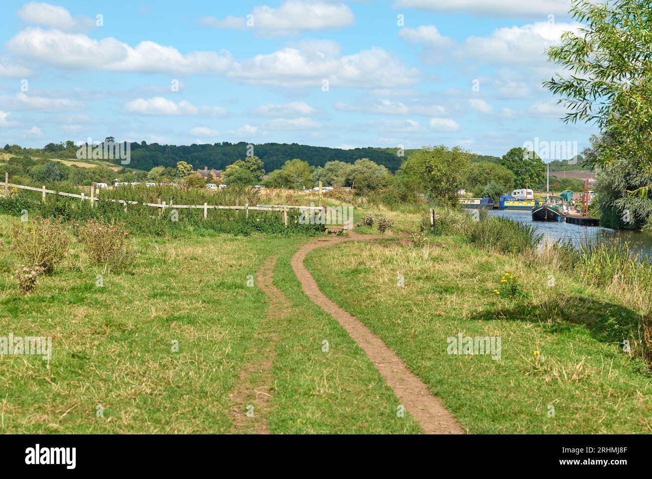 Worn footpath next to a river Stock Photo - Alamy